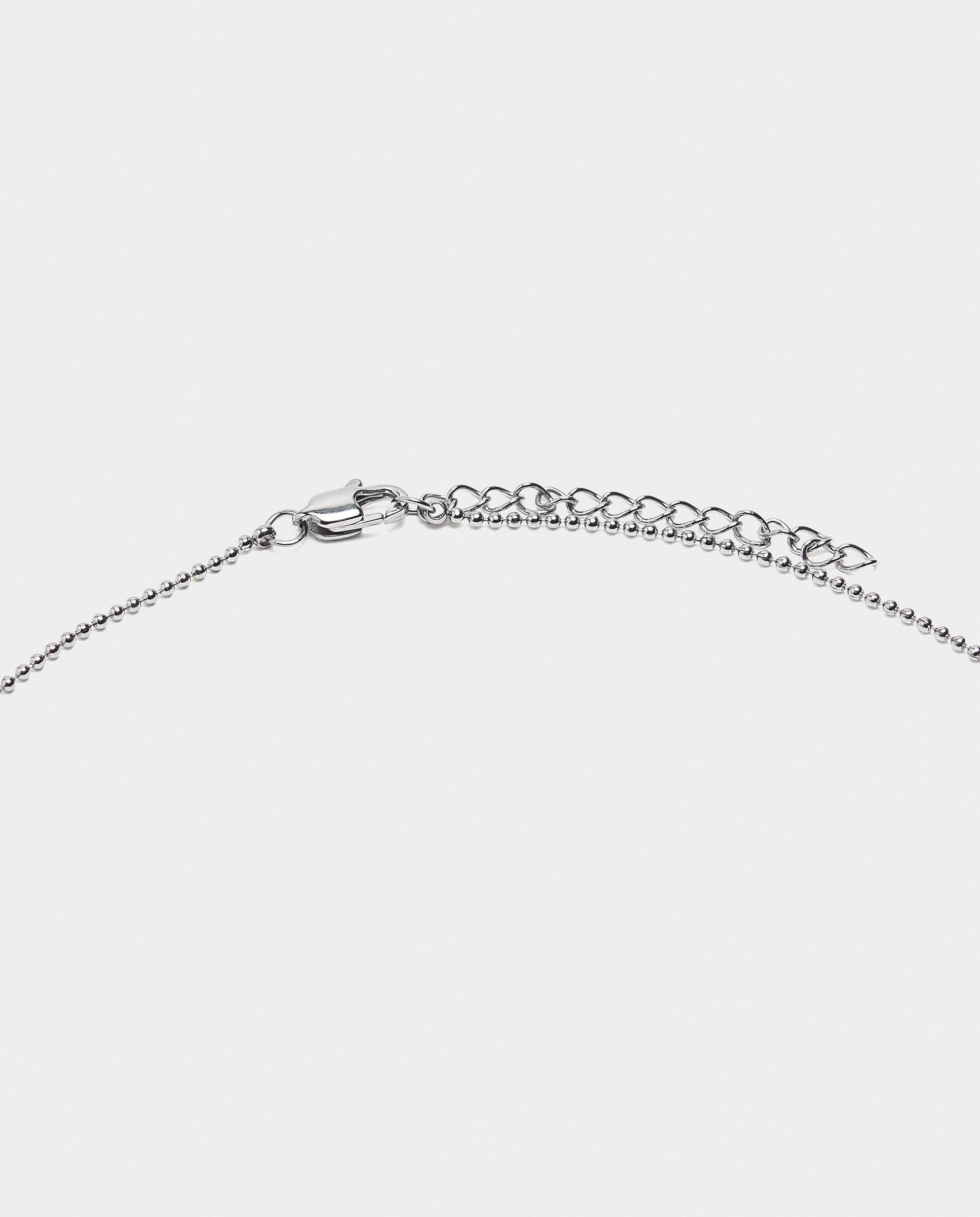 Collar de acero inoxidable corto con circonitas Plateado Parfois · El ...