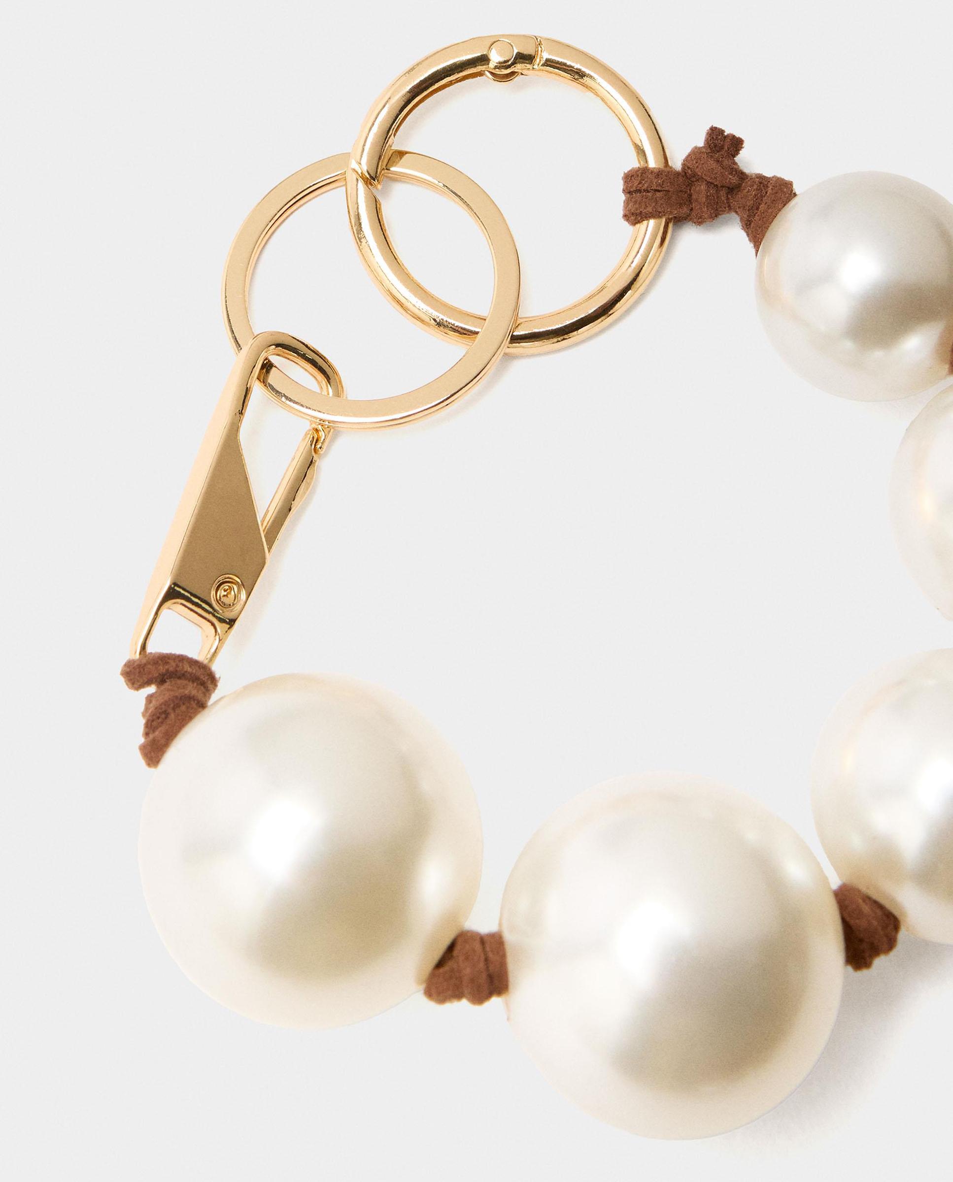 Llavero con cuentas y perlas Blanco Parfois · El Corte Inglés