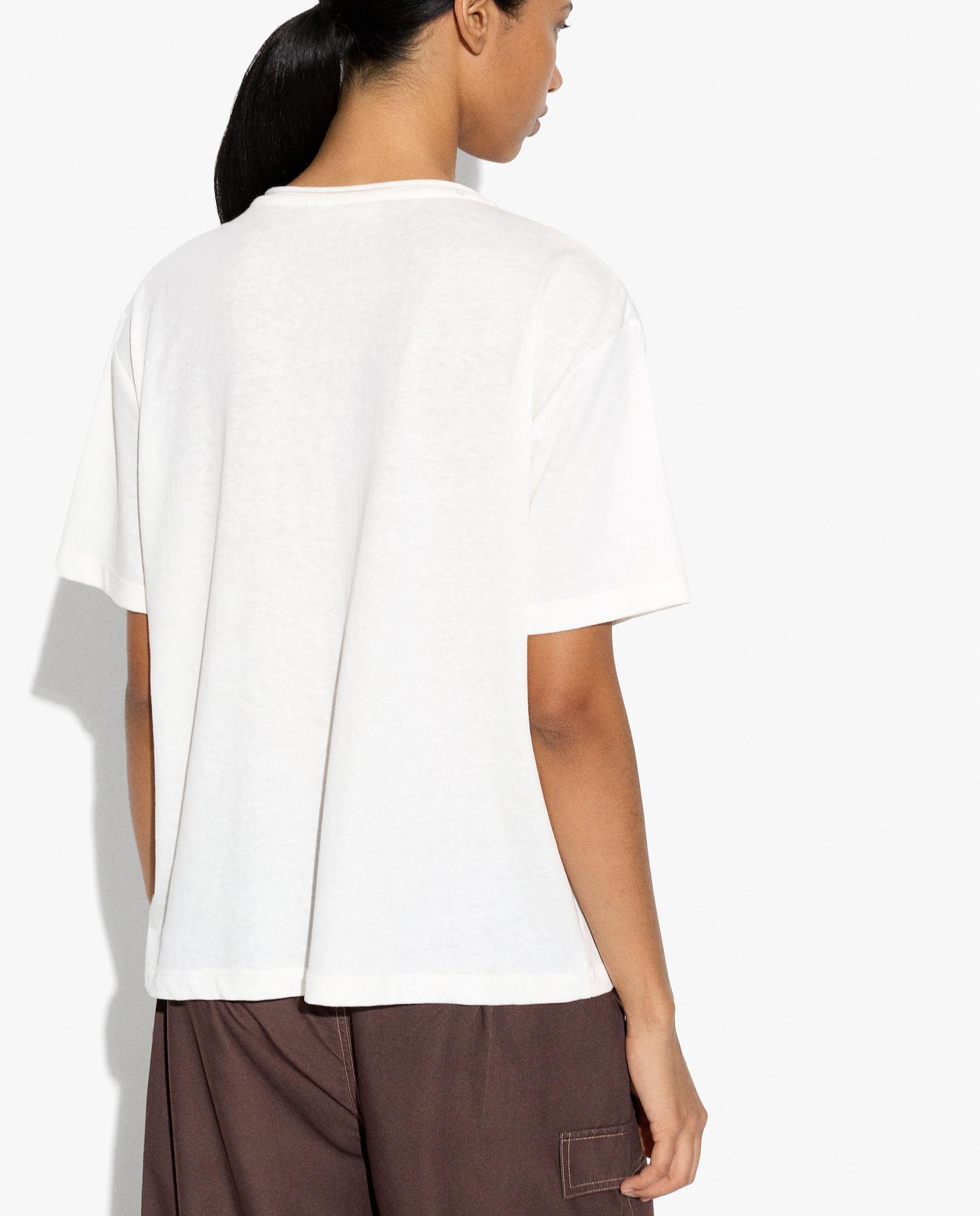 Camiseta de mujer de manga corta con cuello redondo y bolsillo frontal ...