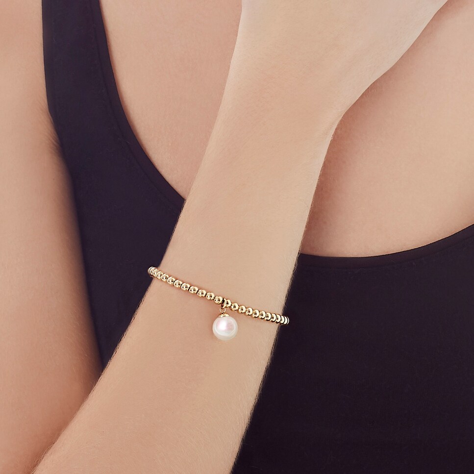 Pulsera Atlas en acero dorado y perla blanca de 10mm · Majorica · El ...
