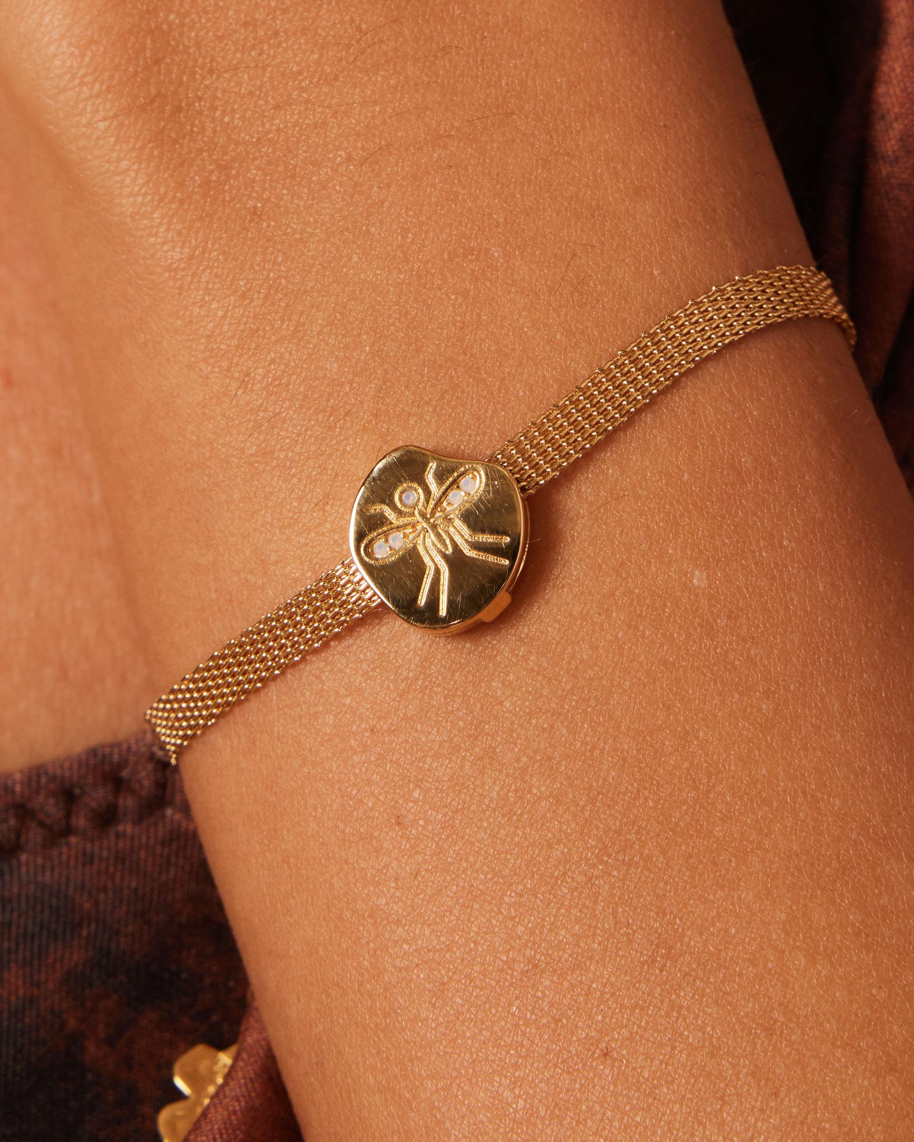 Charm redondo con detalle de mosquito Morado · El Corte Inglés