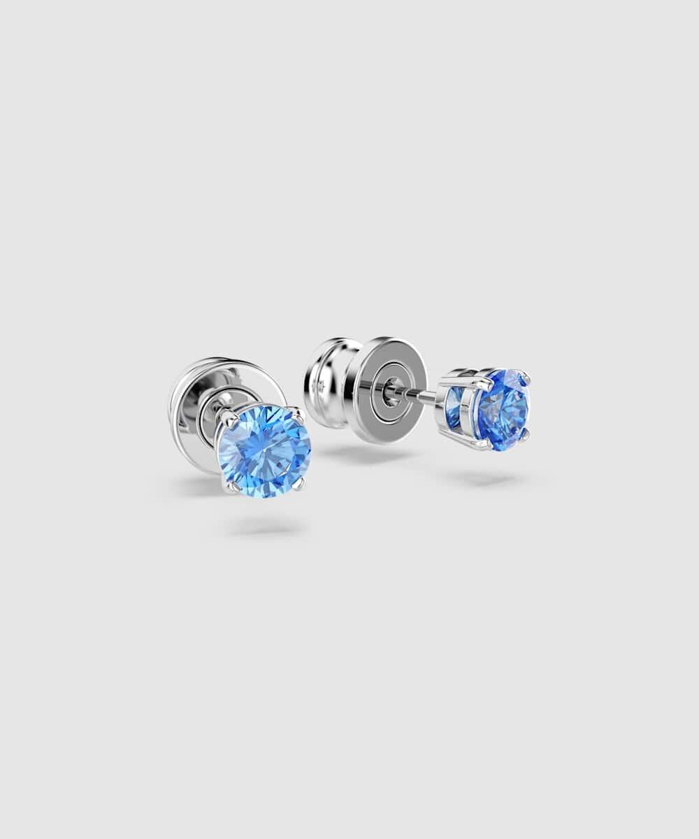 Pendientes de botón stilla bañados en rodio con circonita redonda Azul ...